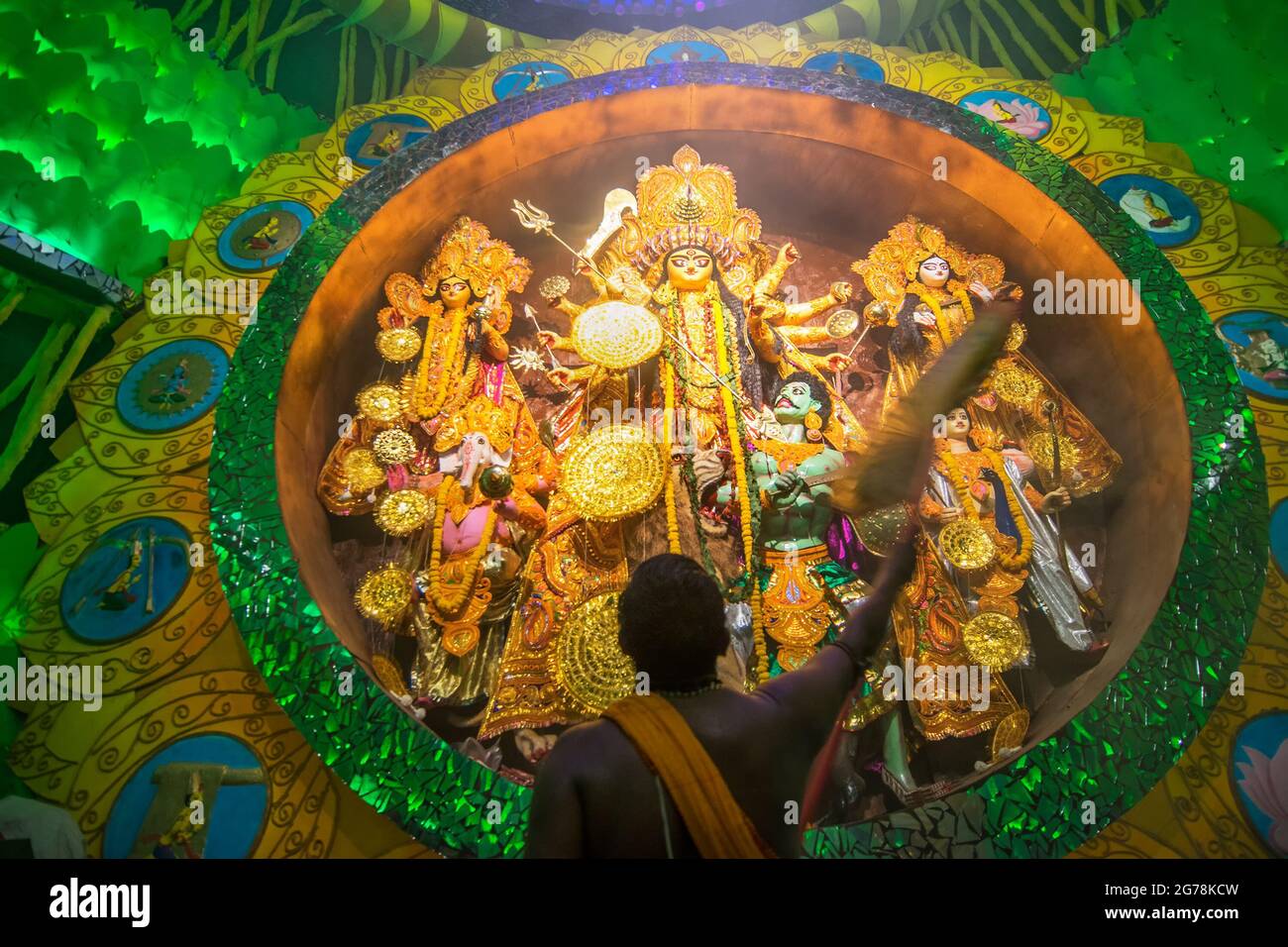 KOLKATA , INDIA - OCTOBER 1, 2014 : Priest praying to Goddesss Durga ...