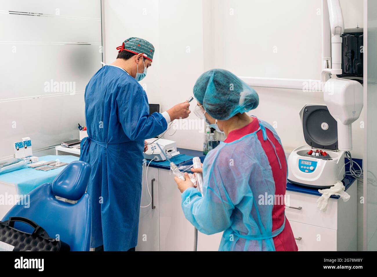Doctor and nurse wearing face mask and protective equipment working in ...