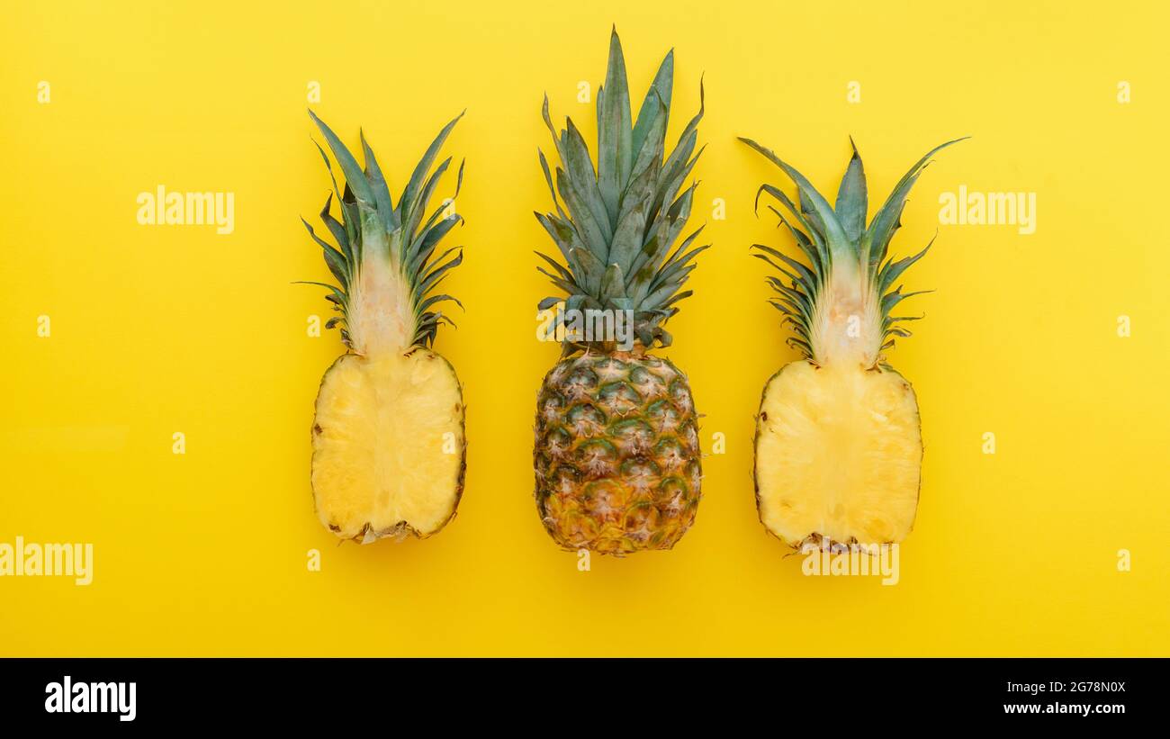 Pineapple fruit on yellow summer background. A whole tropical pineapple ...