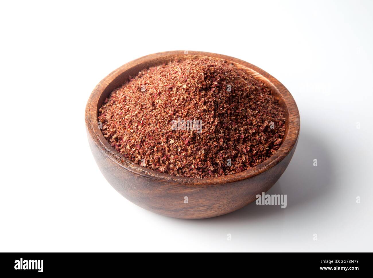 Powder sumac dried in bowl.On white background Stock Photo - Alamy