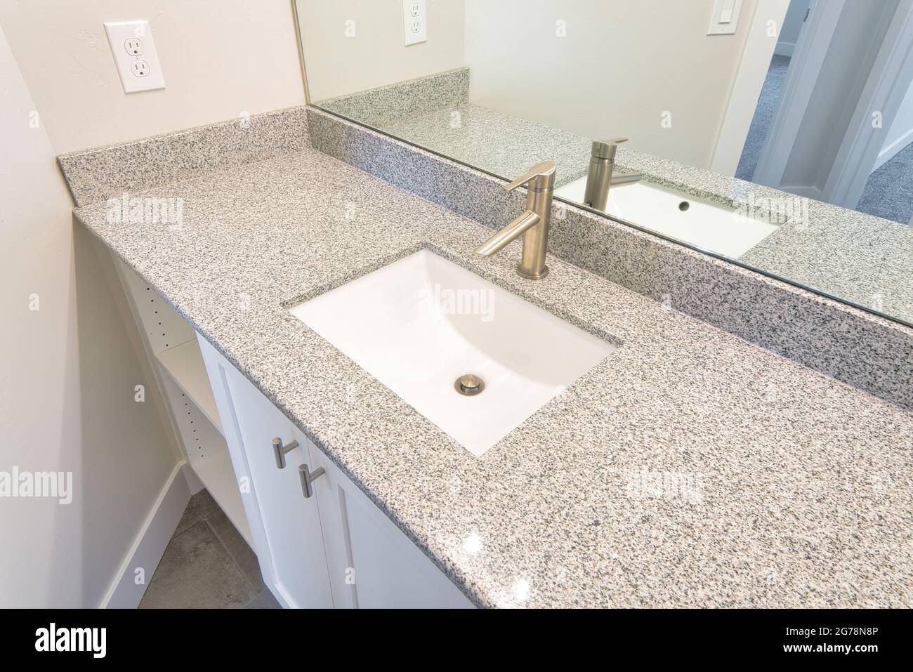 Top view of gray bathroom countertop with single basin sink and faucet ...