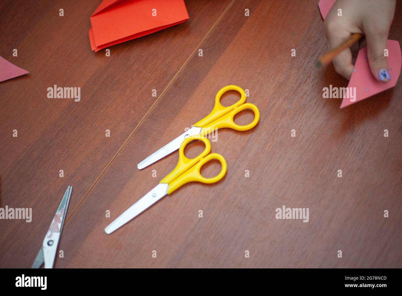 Two scissors are on the table. Tools for creativity. Scissors with a ...