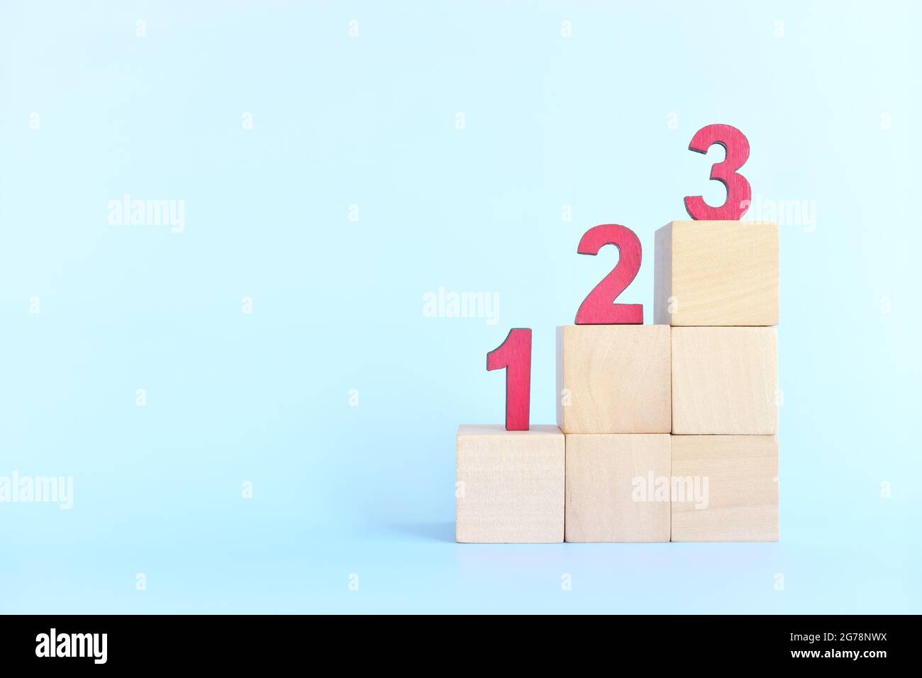 123 numbers on stairs wooden blocks. Small steps towards goal or step ...