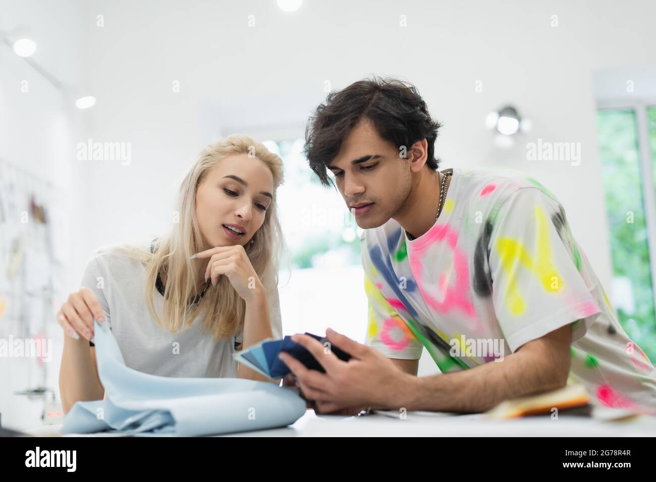 Couple choosing fabric swatches hi-res stock photography and images - Alamy