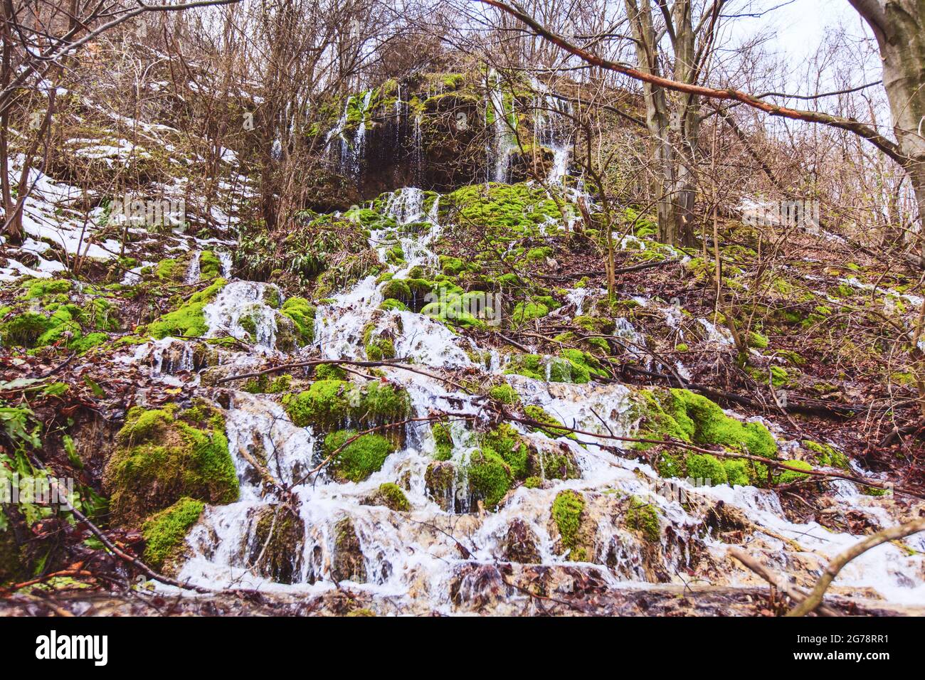 Amazing waterfall stream in forest, early spring. Nature landscape ...