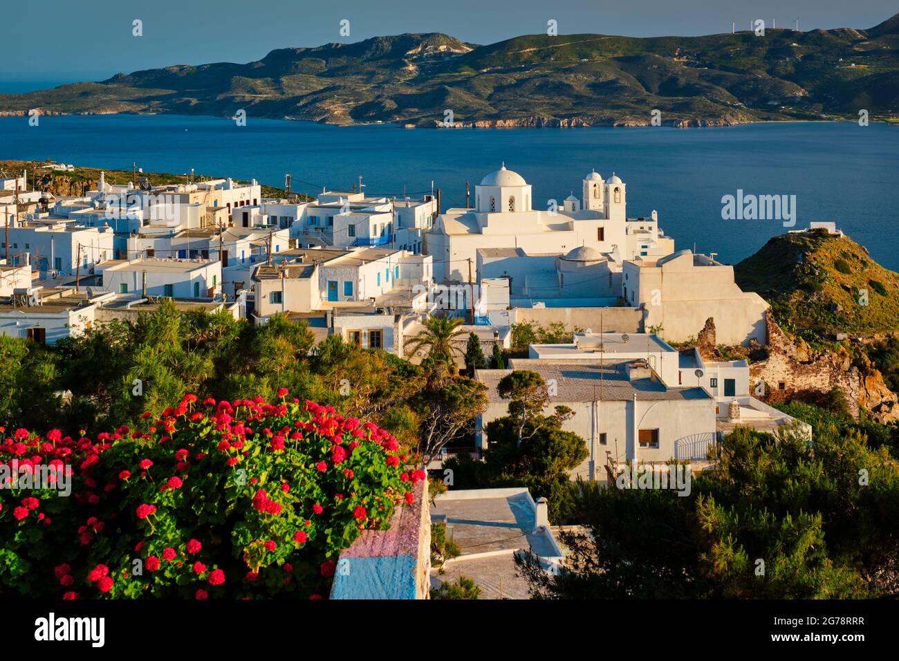 Picturesque scenic view of Greek town Plaka on Milos island over red ...