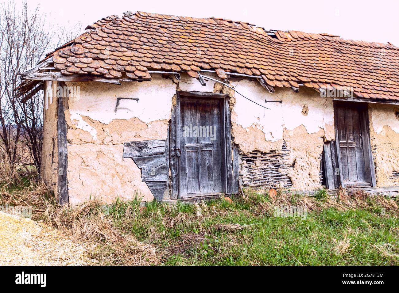 Old ruin abandoned farmhouse. Front view. Rural landscape. Daylight ...