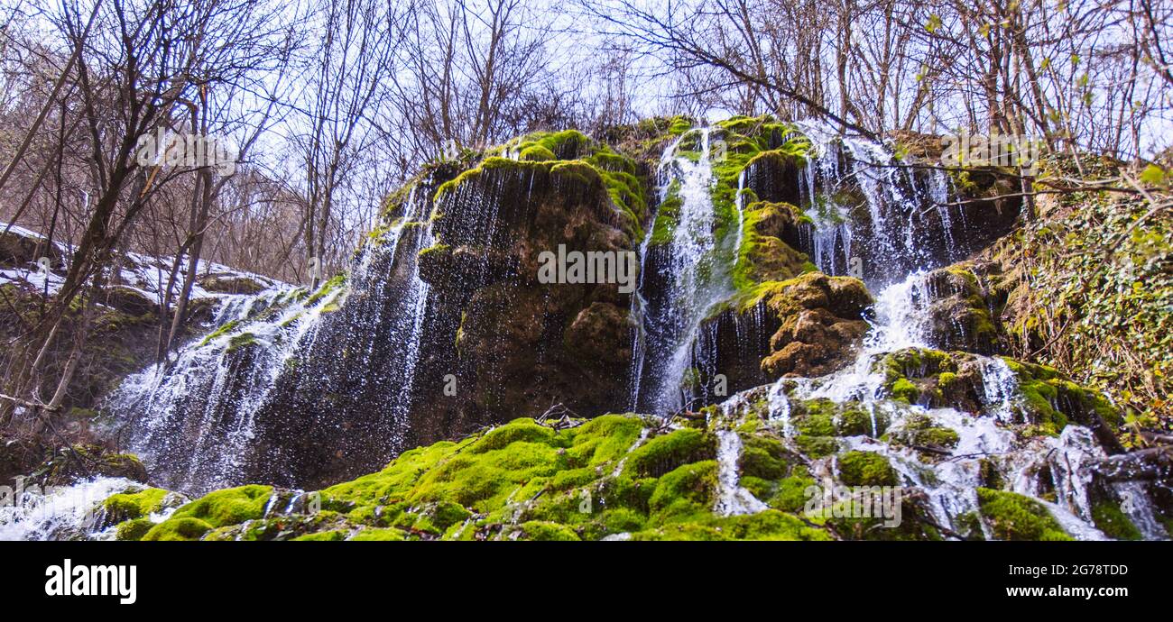 Amazing waterfall stream in forest, early spring. Nature landscape ...