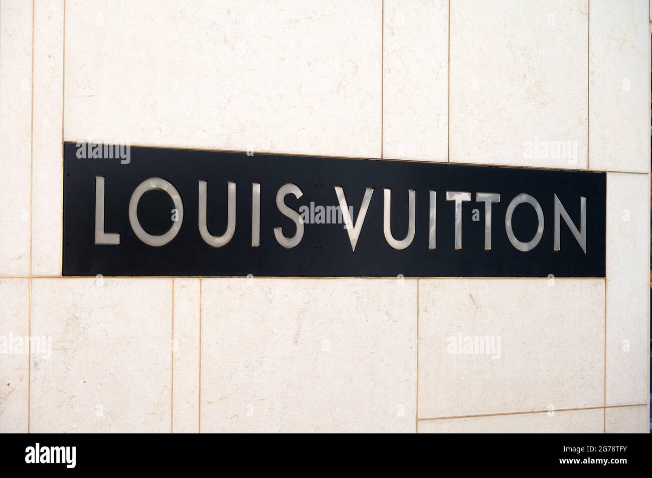 A shop sign of LOUIS VUITTON,on July 12, 2021 in Cannes, France. Photo ...