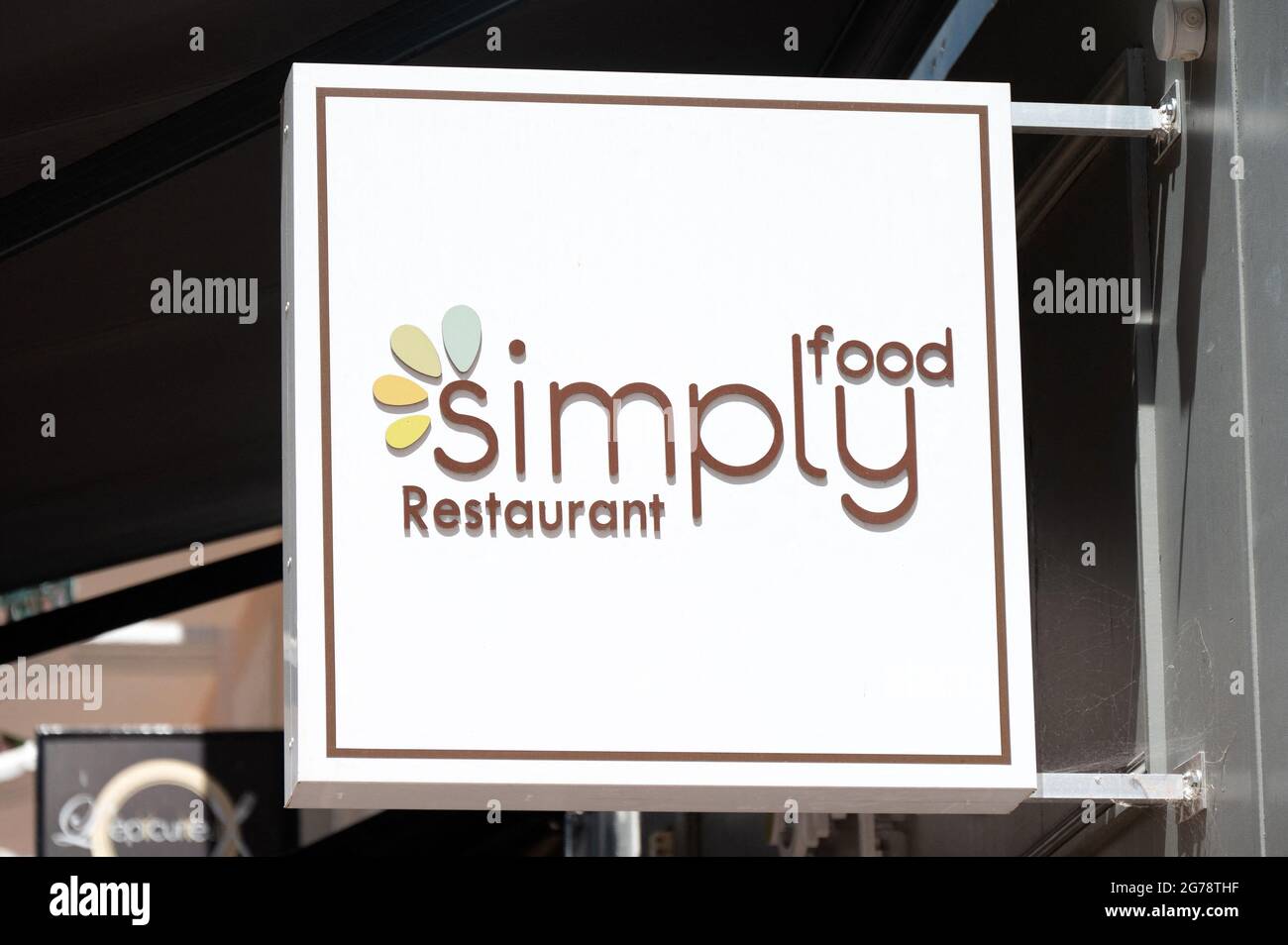 A shop sign of Simply food,on July 12, 2021 in Cannes, France. Photo by ...