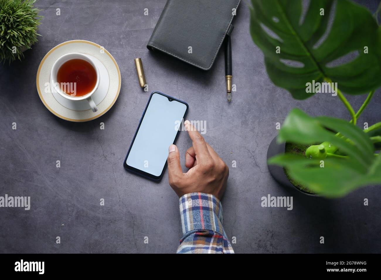 top view of man hand using smart phone on black background Stock Photo ...