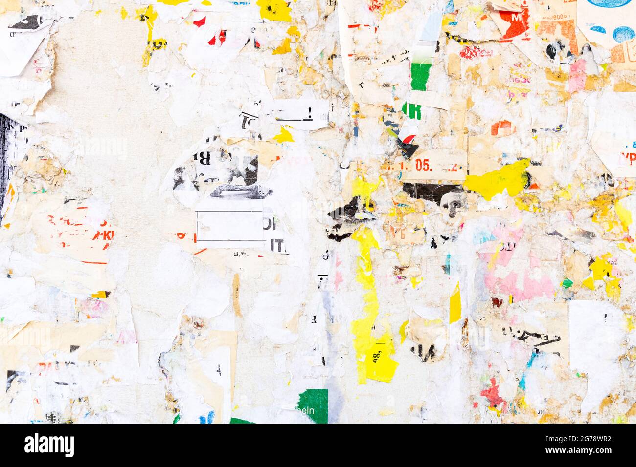 Collage of many numbers and letters ripped torn advertisement street ...