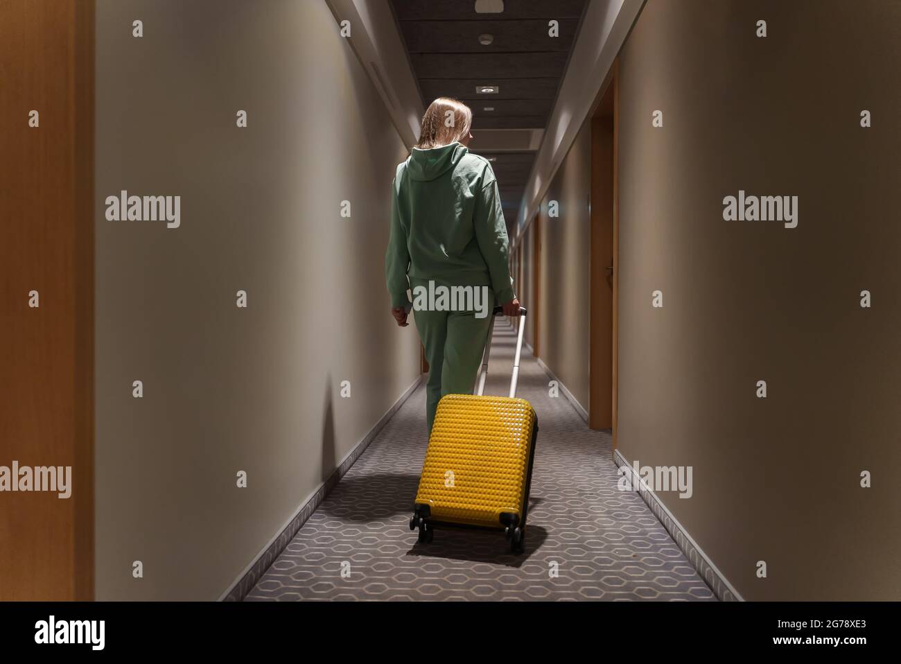 Girl in hotel corridor hi-res stock photography and images - Alamy