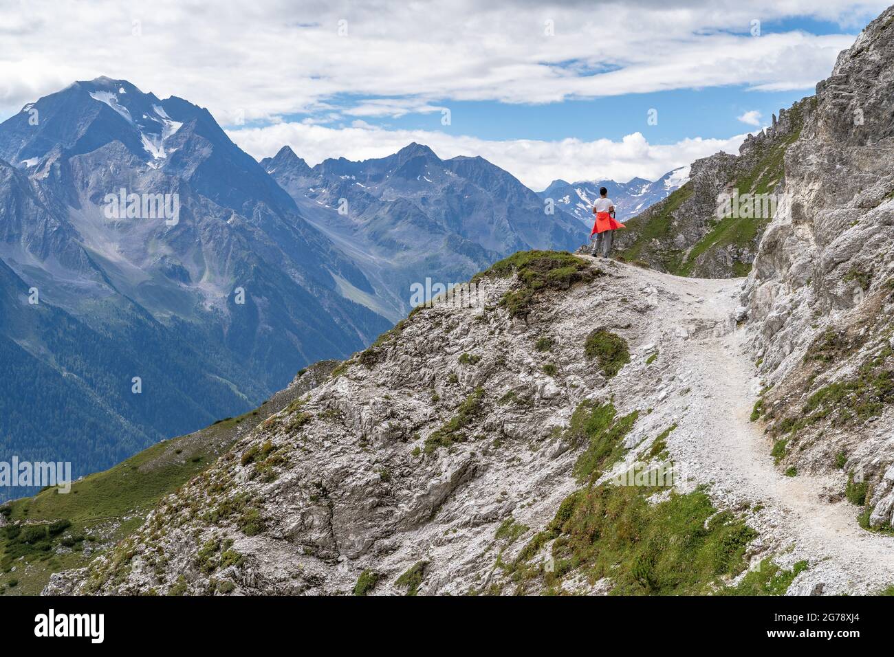 Europe, Austria, Tyrol, Stubai Alps, mountain hiker on the panorama ...
