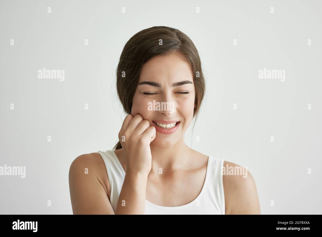 woman with toothache holding her face discomfort dentistry Stock Photo ...