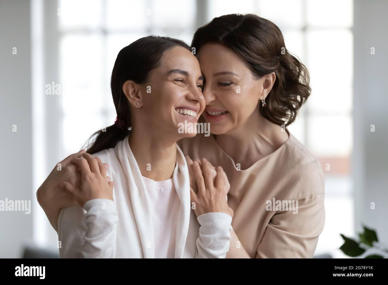 Loving older mom hug smiling grownup daughter Stock Photo - Alamy