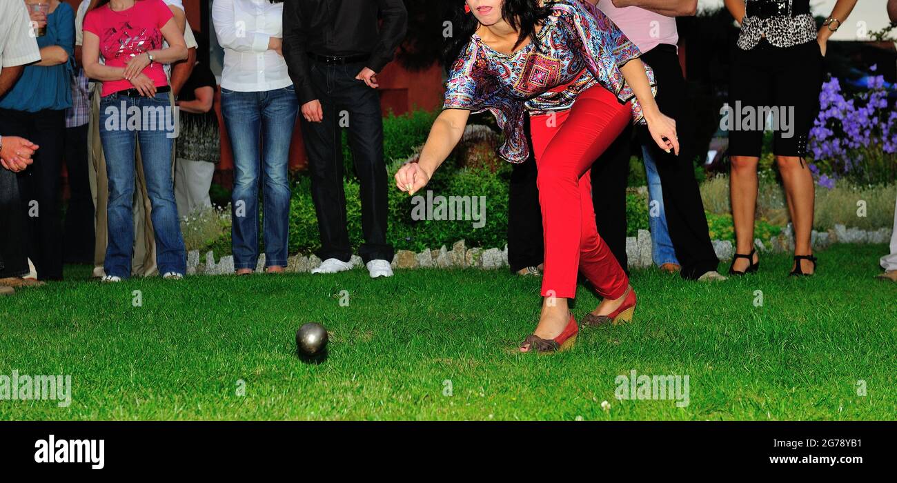 Playing petanque in the late afternoon,People playing boules, petanque ...