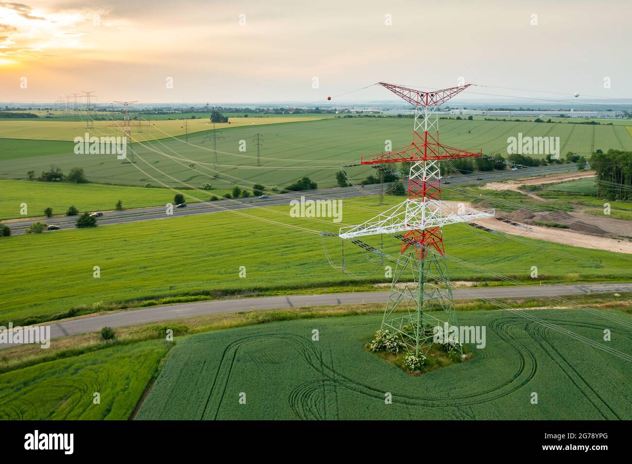 Aerial view of electric power transmission lines at sunset Stock Photo ...