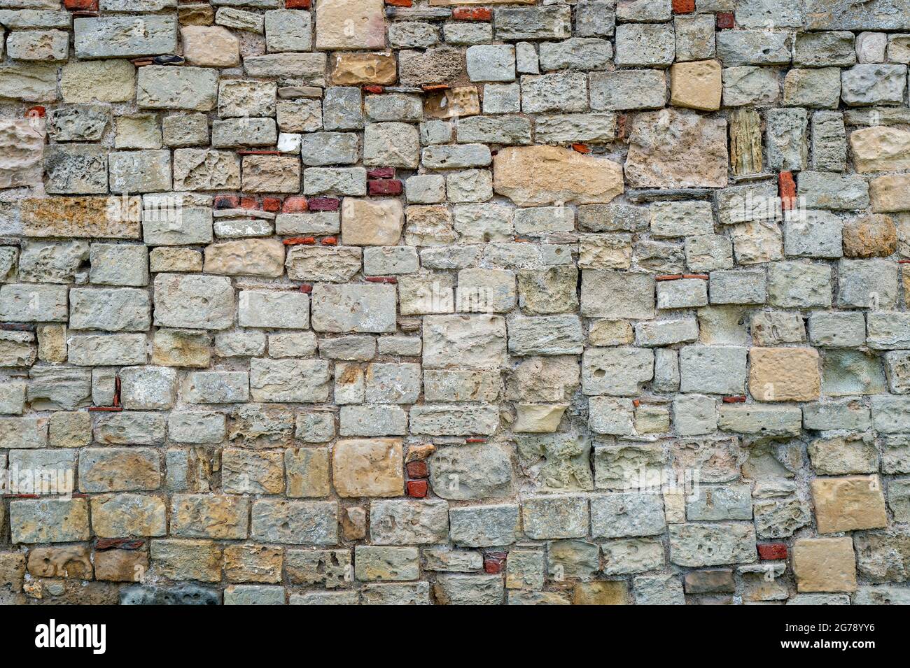 multi textured stone wall, background Stock Photo - Alamy