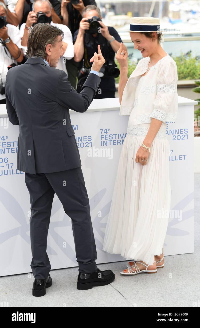 Cannes, France, 12 July 2021 Tim Roth and Vicky Krieps at the photocall ...