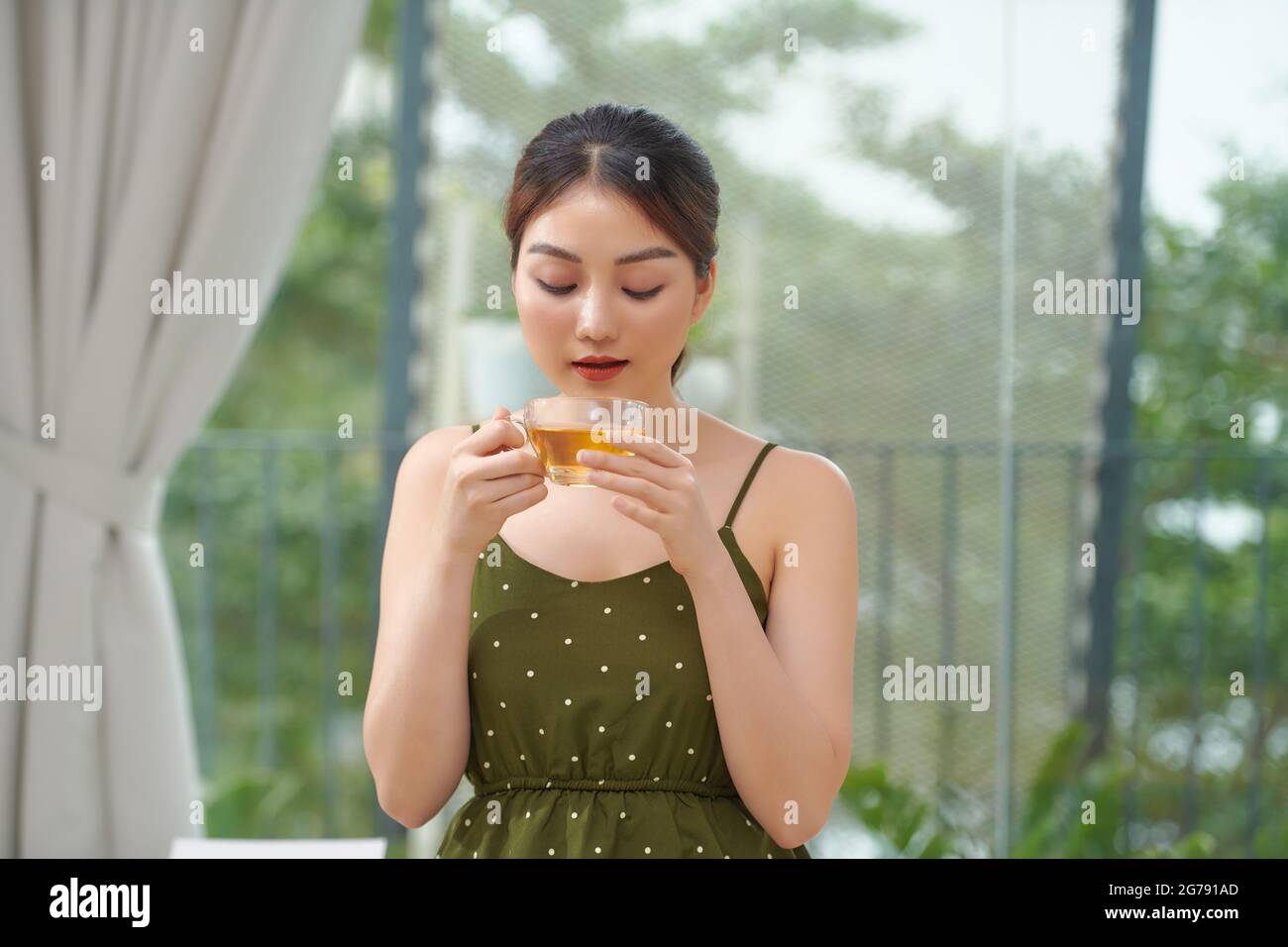 Standing by windows hi-res stock photography and images - Alamy