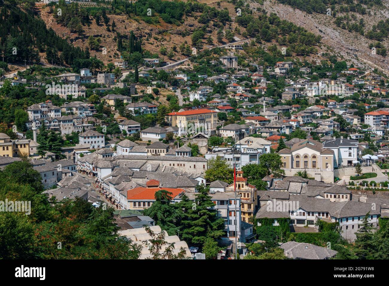 Traditional Albanian white houses with stone gray roofs and modern ...