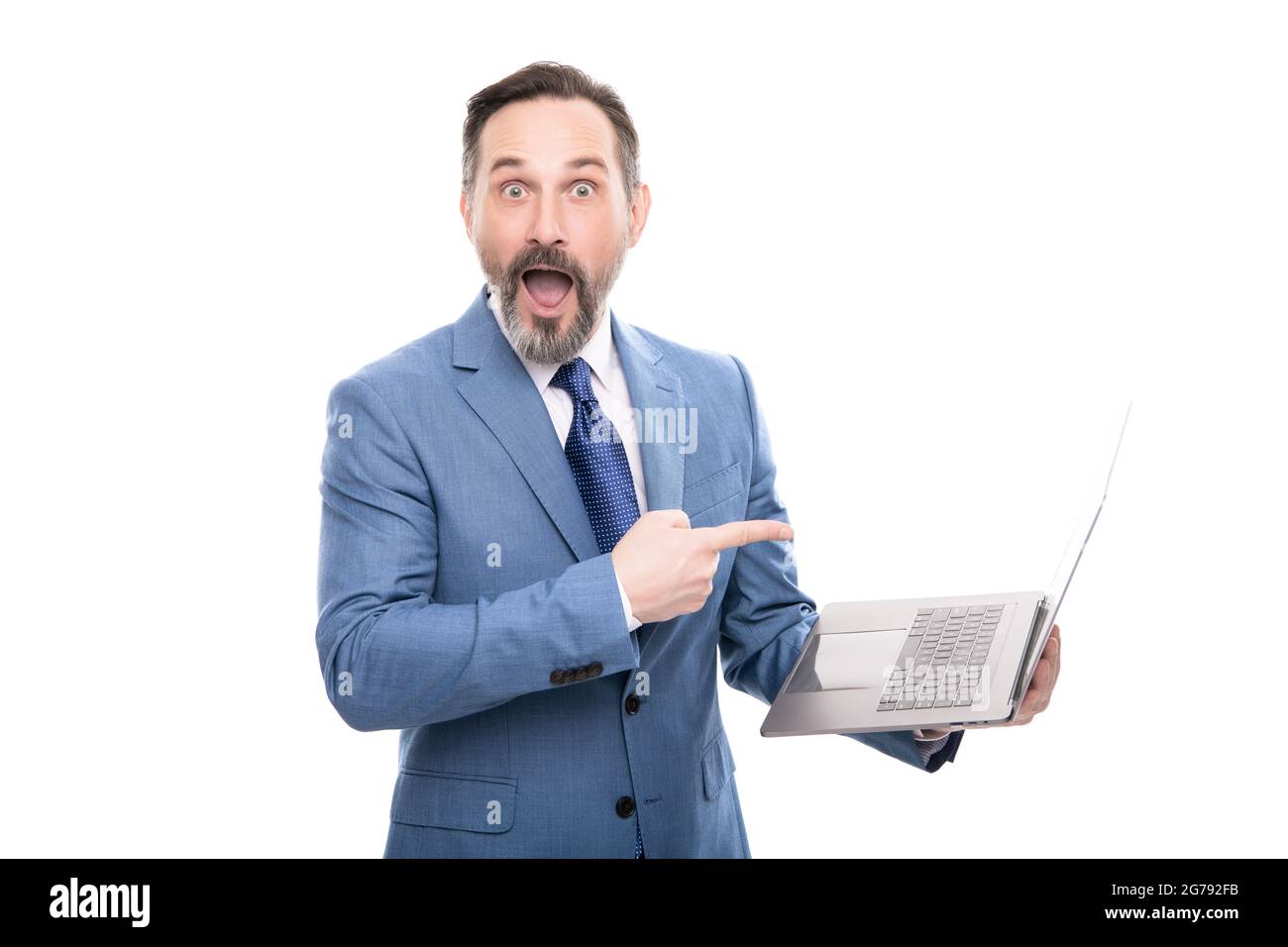 amazed boss pointing finger on modern wireless laptop. mature ...