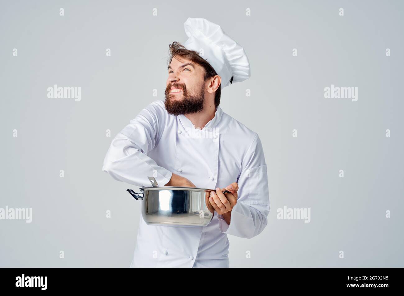 male chef preparing food in a saucepan kitchen professional Stock Photo ...