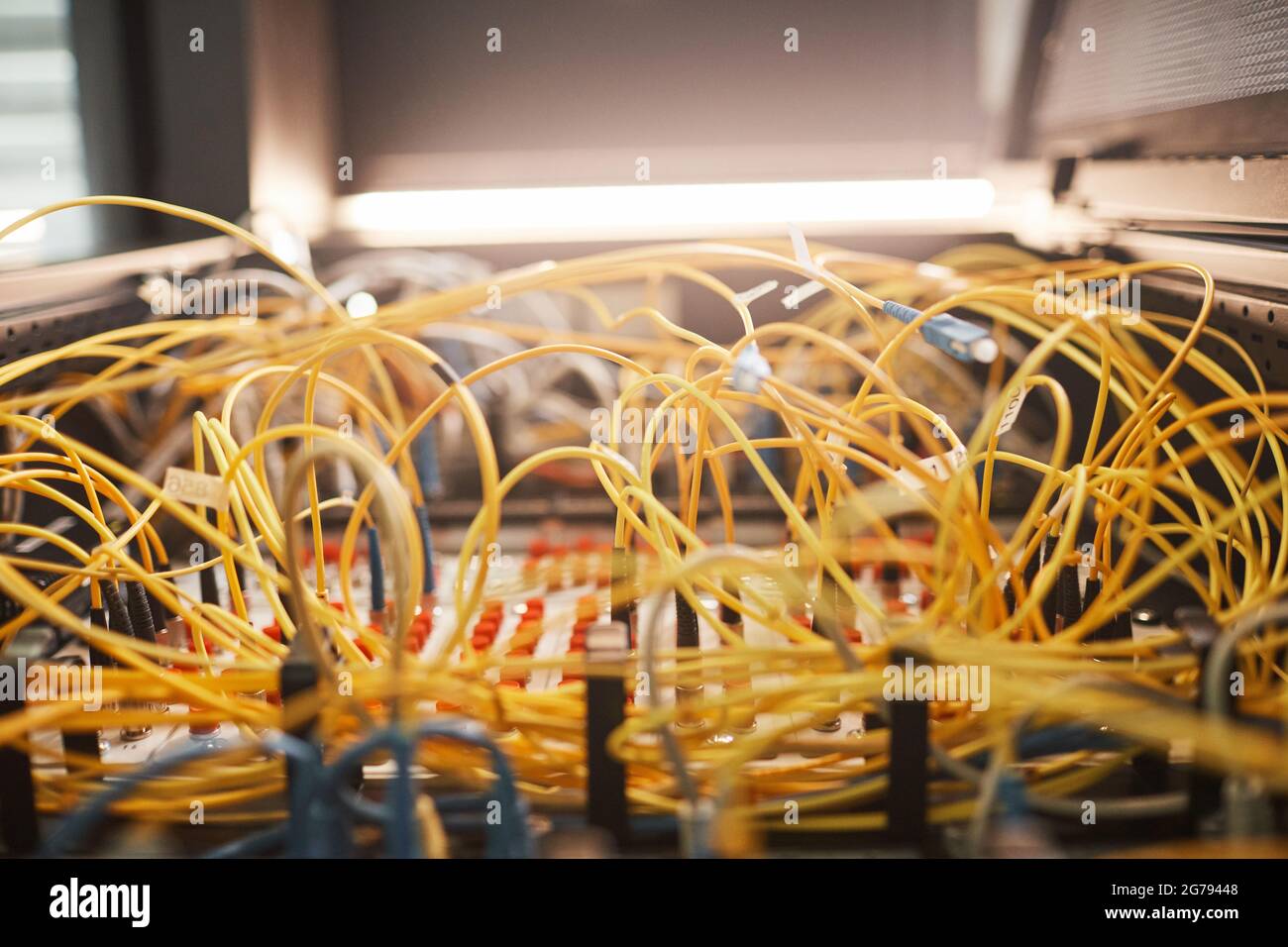 Close up of yellow wires in server room at data center background, copy ...