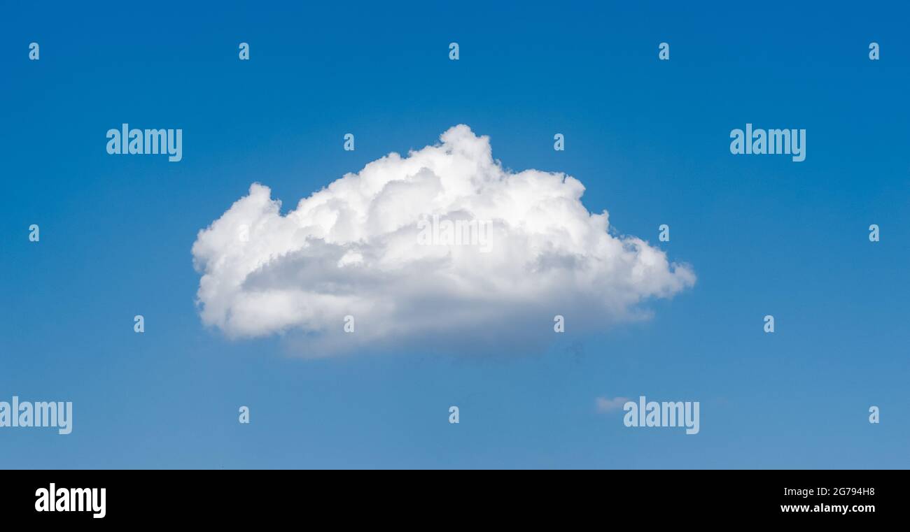 One single cumulus cloud in the blue sky, natural background or ...