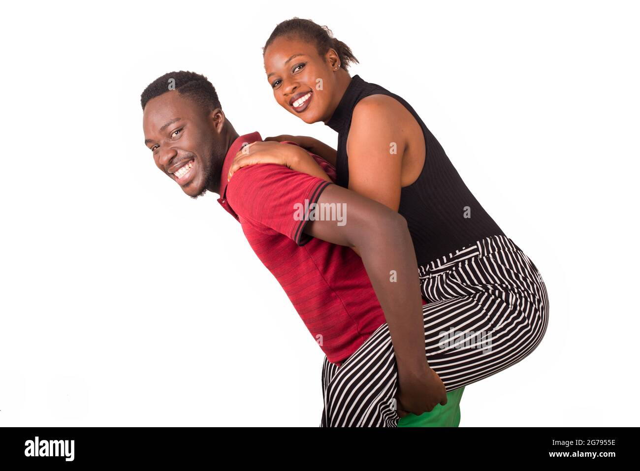 Charming girl enjoys life and love on the back of her boyfriend inside ...