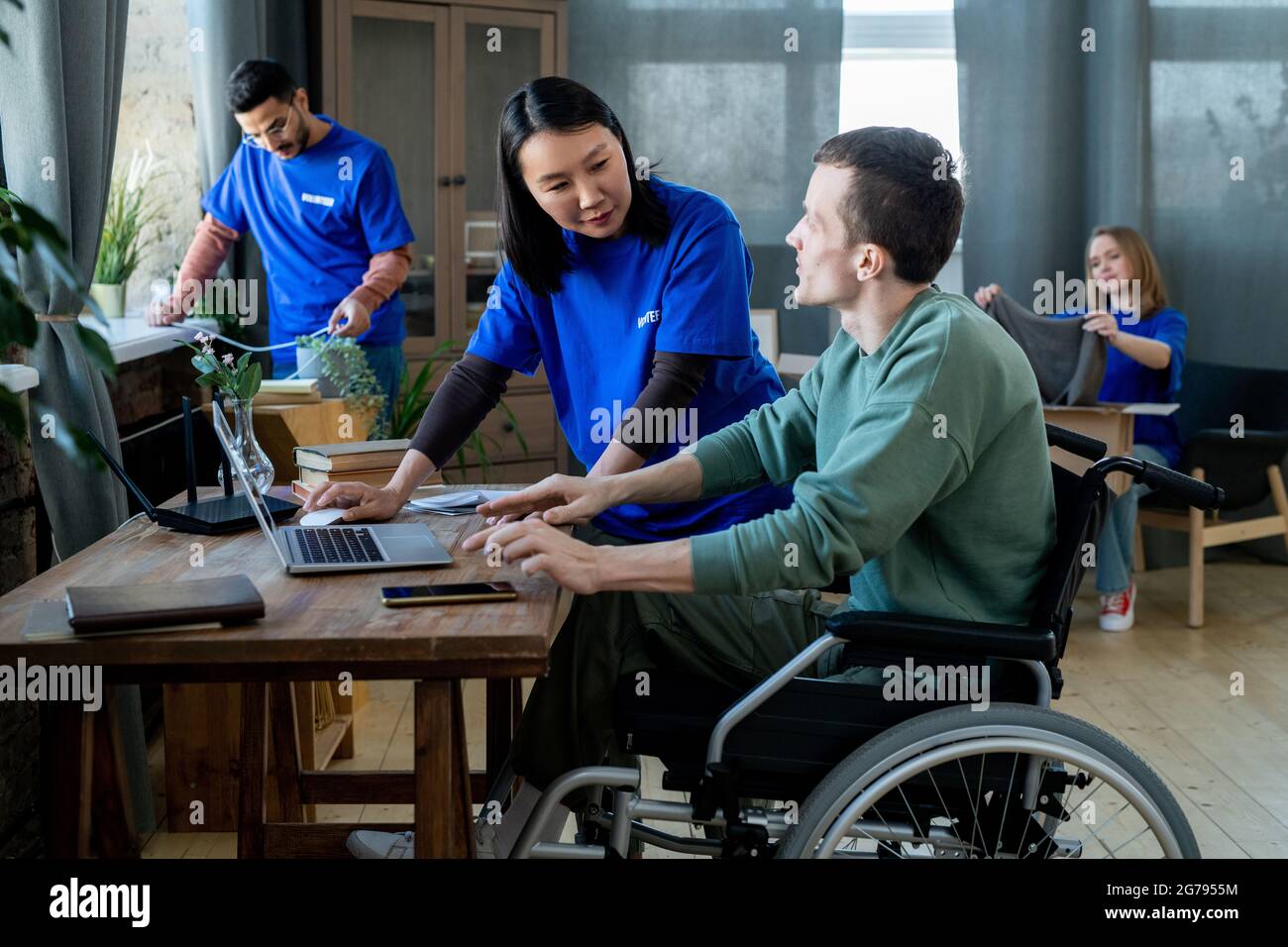 Helping Disabled Young Person High Resolution Stock Photography and ...