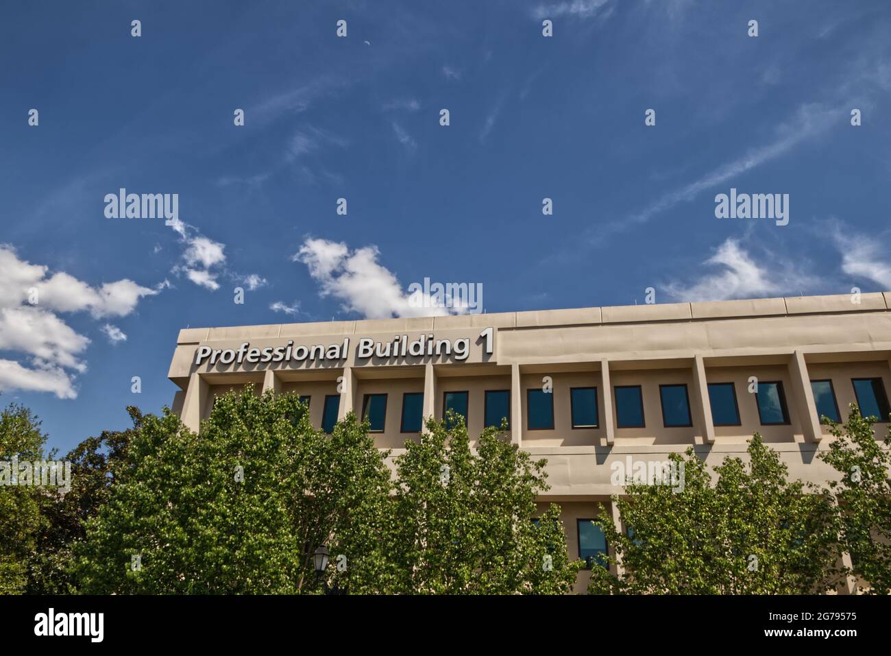 A Professional building complex exterior partial building and sign view ...