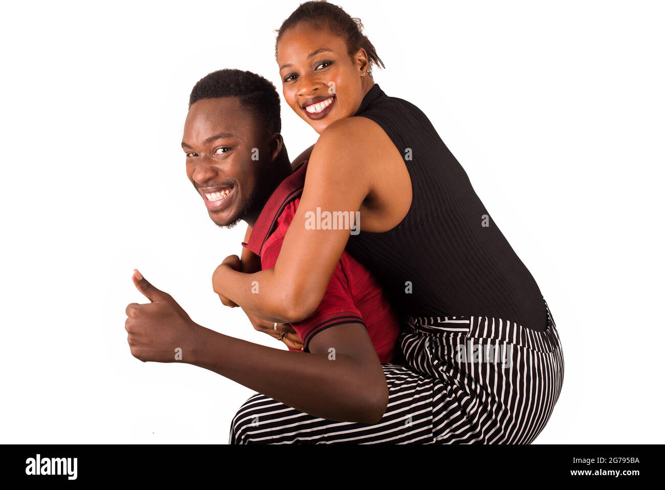 Charming girl enjoys life and love on the back of her boyfriend inside ...