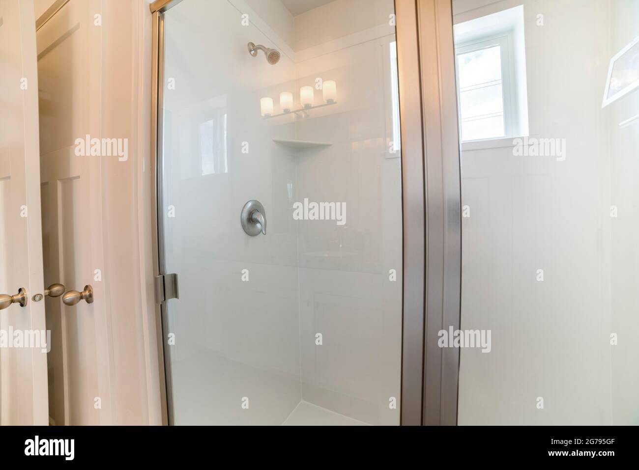 Bathroom interior of a shower stall with glass and stainless steel ...