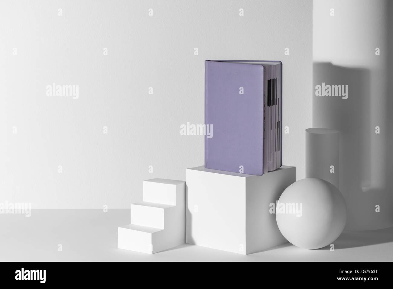 Violet diary on white 3d paper shapes with copy space Stock Photo - Alamy