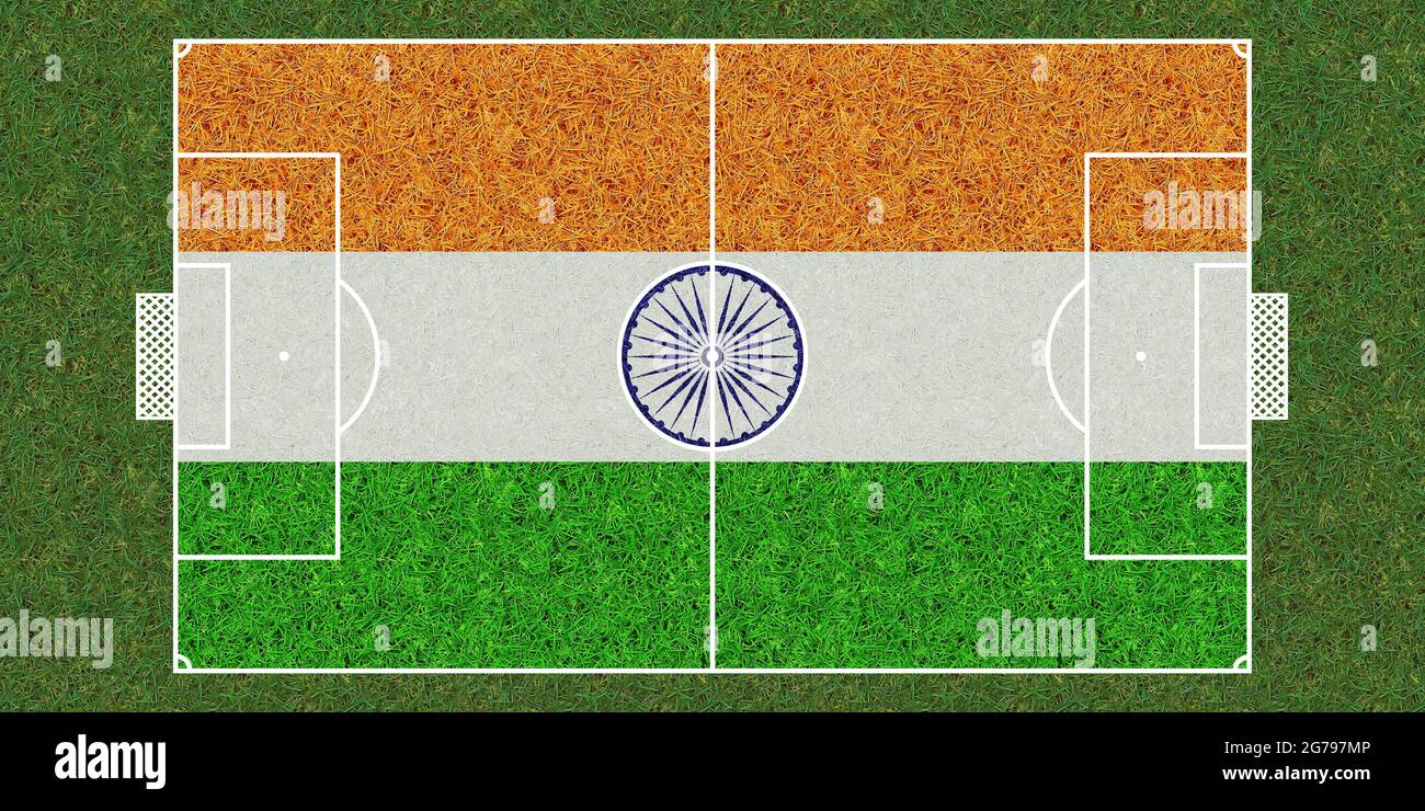Top view of Green grass soccer field with flag of India. football ...