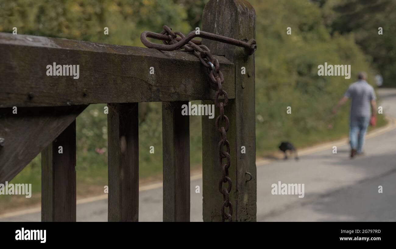 Gate with metal chain which is open Stock Photo - Alamy