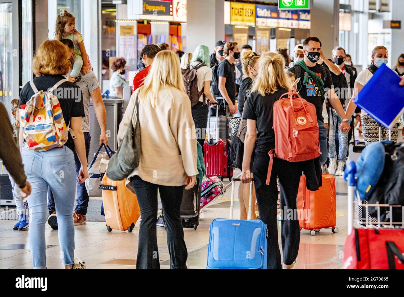 Crowded with travelers going on vacation in the summer holidays, at at ...