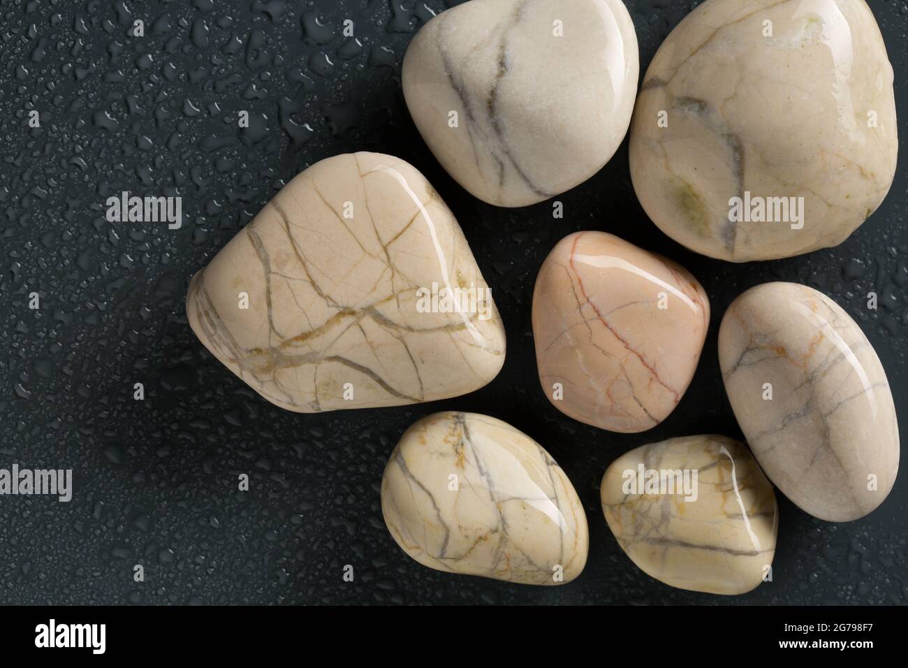 colorful sea pebbles with water drops Stock Photo - Alamy