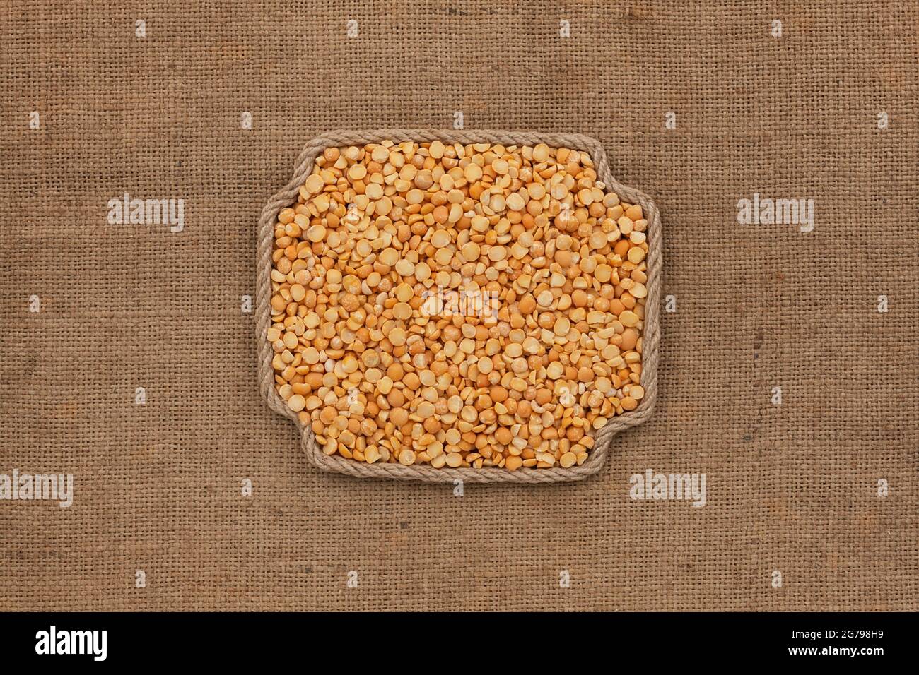 Frame made of rope with a whole, ripe peas grain. With space for design ...