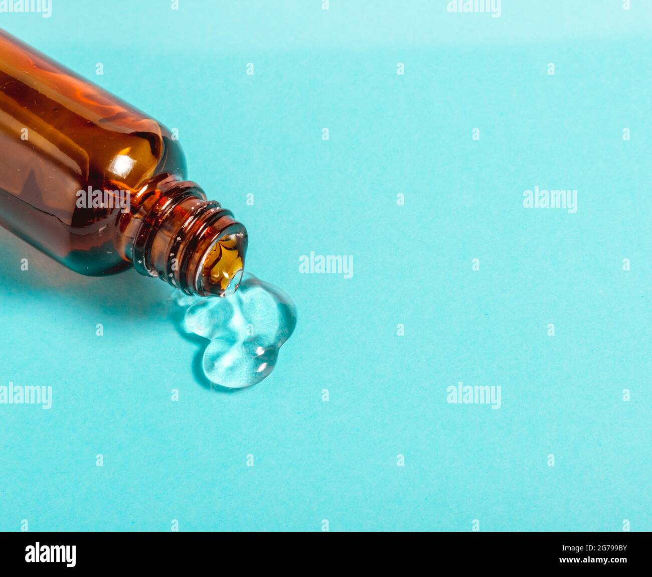 Hydrating sanitizer blob gel in glass bottle container. Transparent ...