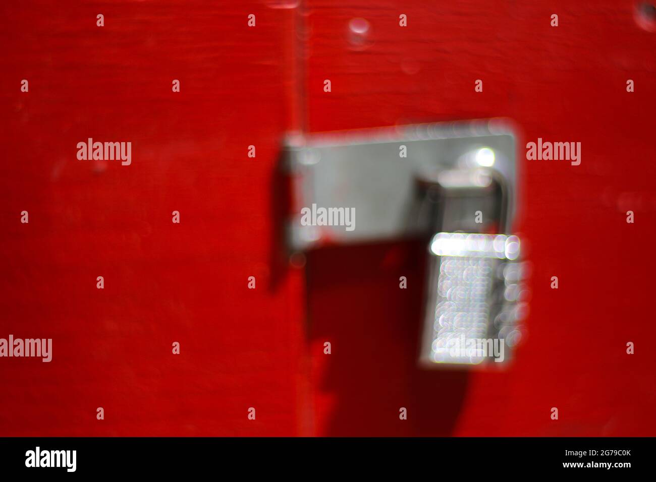 Bolt with combination lock against a red background. Emotional motifs ...