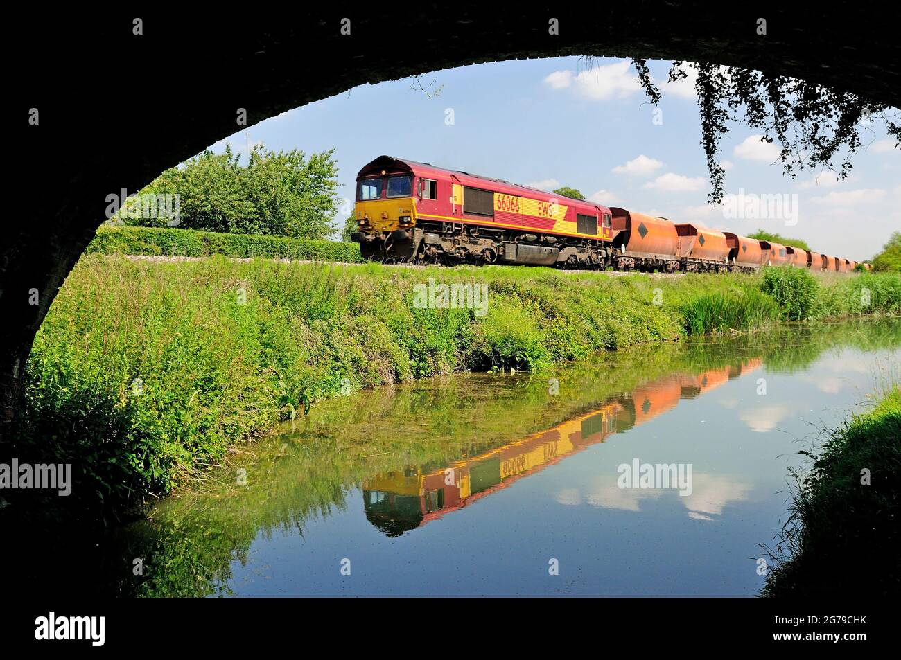 A down empty hopper train hauled by EWS class 66 loco No 66066 beside ...