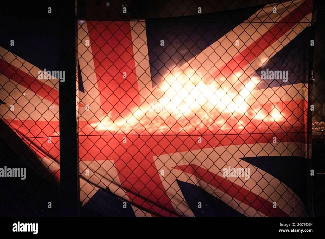Belfast, UK. 11th July, 2021. The Sandy Row bonfire as viewed through ...