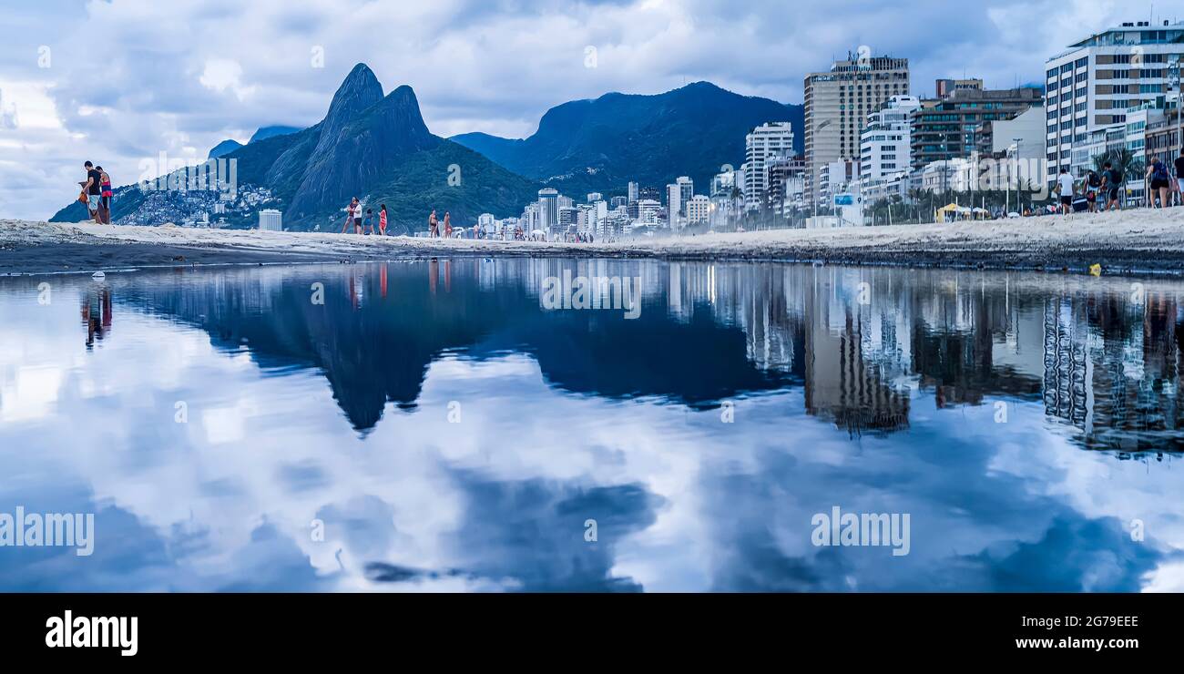Big Puddle of water after rain reflecting Two Brothers Mountain (Dois ...