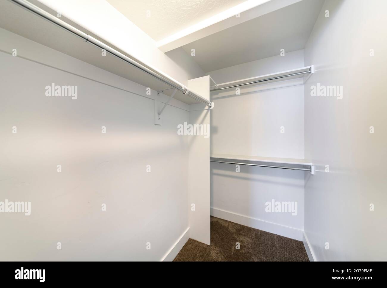 Interior of an empty walk-in closet with carpet floor Stock Photo - Alamy
