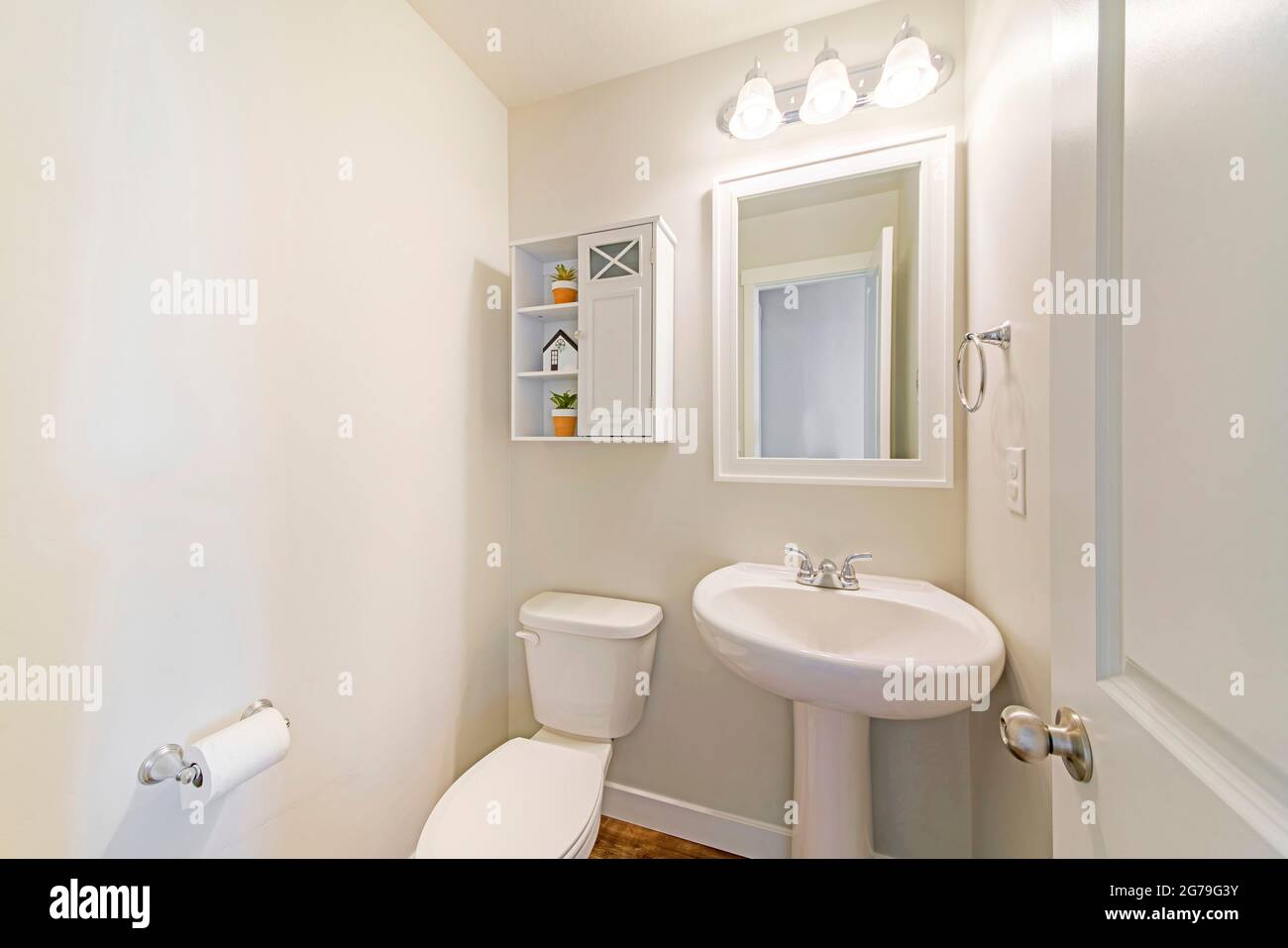 Interior of a white powder room with minimalist design Stock Photo - Alamy