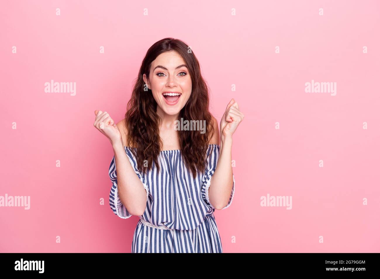 Photo of nice hooray brunette lady hands fists wear blue dress isolated ...