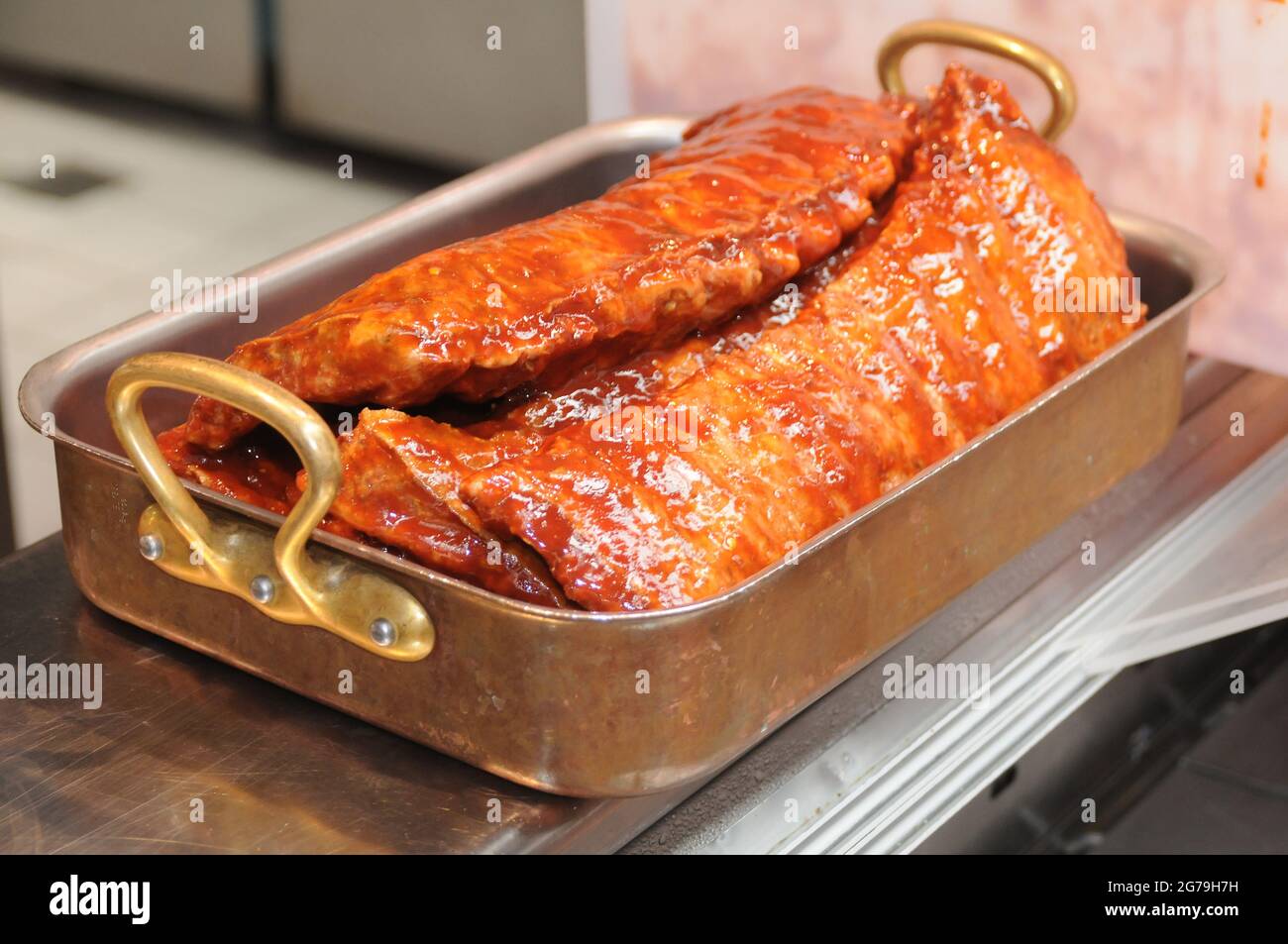 Copenhagen, Denmark. 12July 2021,Butcher prepares pork for brbecuse in ...